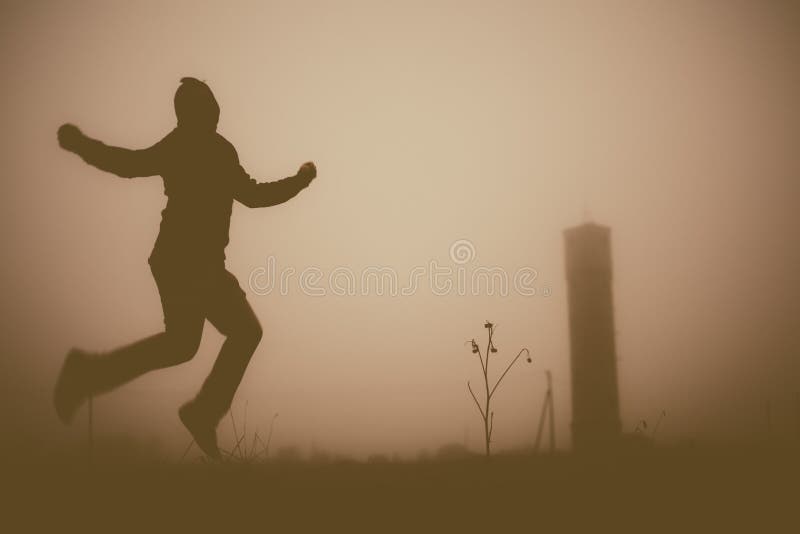 Silhouette of the Jumping Person in the Evening. Stock Image - Image of ...