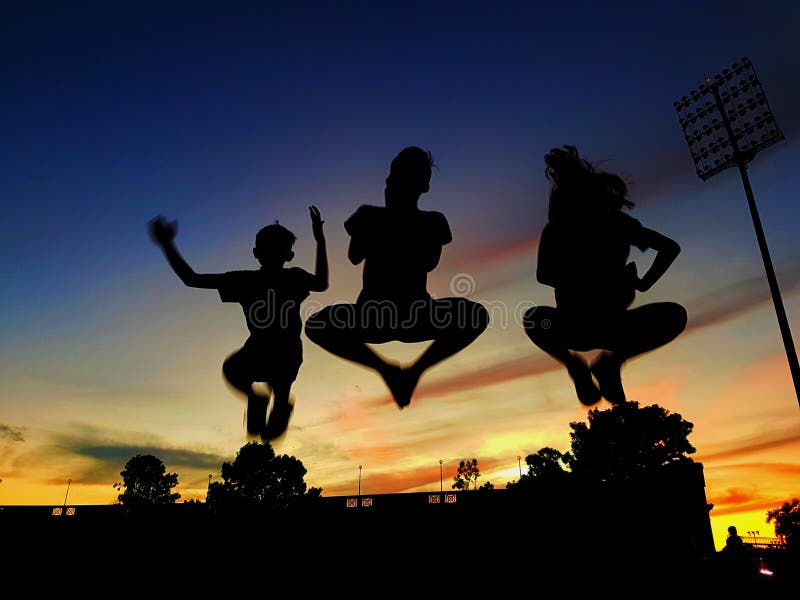 Silhouette of 3 Kids Jumping Stock Image - Image of three, silhouette ...