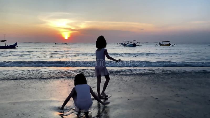 Silhouette of Kids Playing in Beach during Sunset Playing with Waves ...