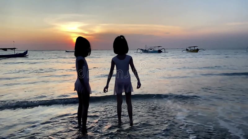 Silhouette of Kids Playing in Beach during Sunset Playing with Waves ...