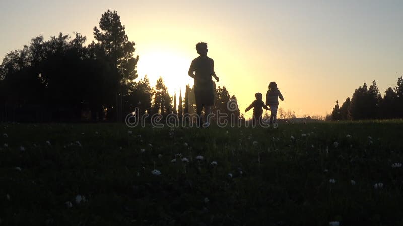 Silhouette of Kids Running Away at Sunset Stock Footage - Video of ...