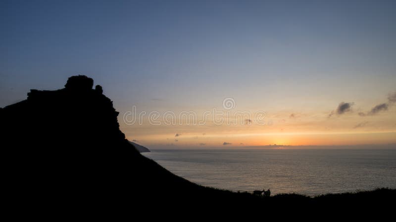 Silhouette Landscape Image of Valley of the Rocks in Devon at Sunset ...