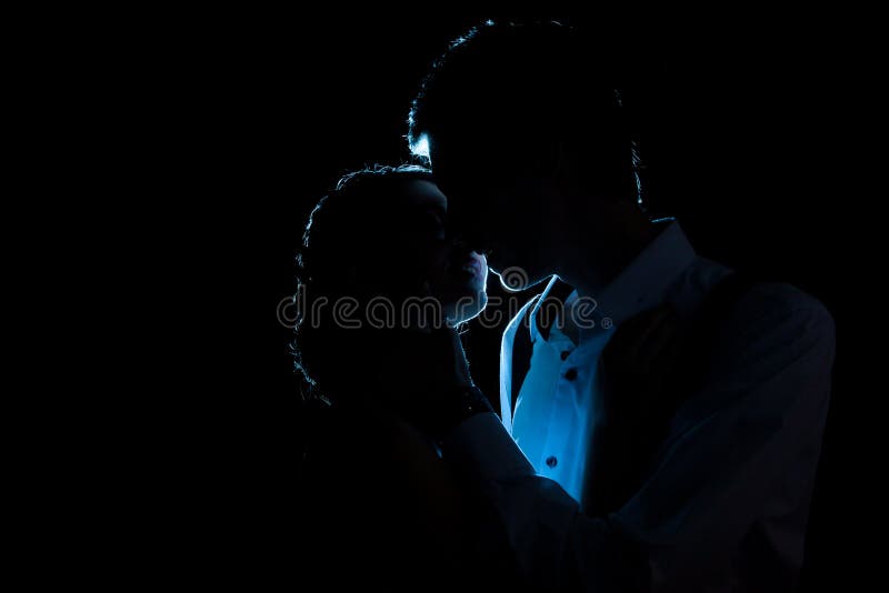 Silhouette Of Loving Couple With A Blue Light Behind Stock Image ...