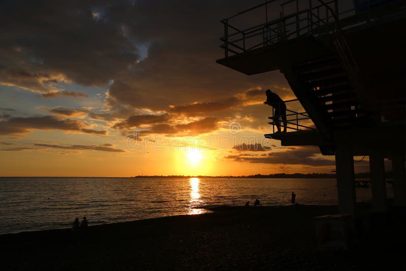Silhouette of a Man on the Balcony Overlooking the Sea Stock Image ...