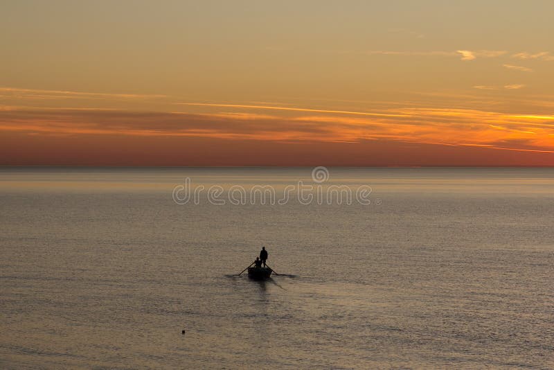 Silhouette of the Man in a Boat Stock Photo - Image of beach, lake ...