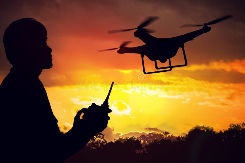 Silhouette Of A Man Controlling Flying Drone. 3D Rendered Illustion Of ...