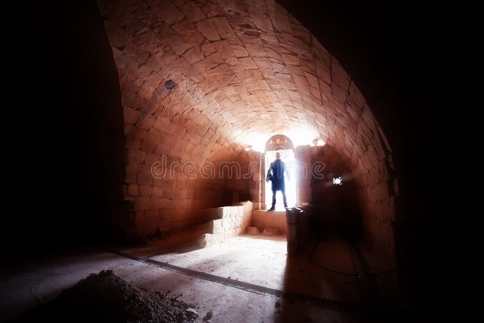 Silhouette of man in crypt stock image. Image of cement - 27635207