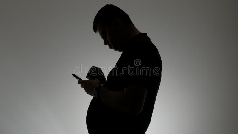 The Silhouette of a Man with a Curved Spine. a Stooping Man with a ...