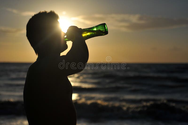 Silhouette of a Man Drinking Beer on the Beach Stock Image - Image of ...