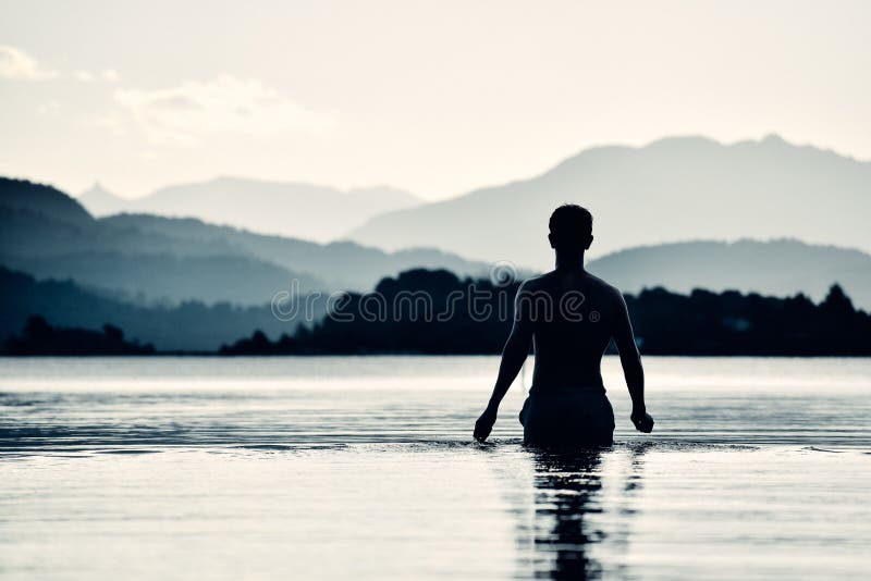 Silhouette of a Man Entering into Sea Stock Photo - Image of ocean ...