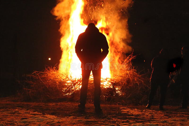 Silhouette of Man by the Fire at Night. Stock Image - Image of firewood ...