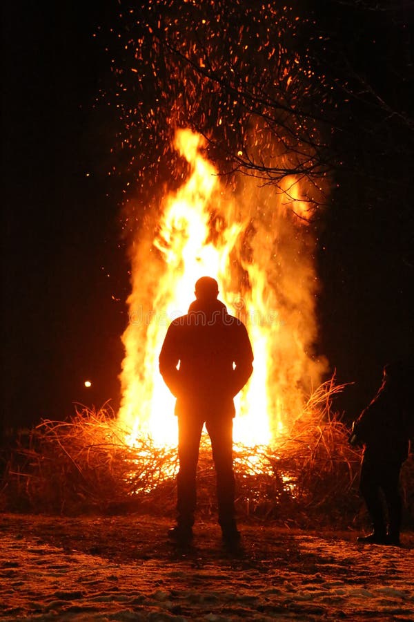 Silhouette of Man by the Fire at Night. Stock Image - Image of firewood ...