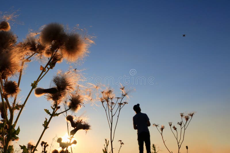 Silhouette of a Man Flying a Remote Control Drone Stock Image - Image ...