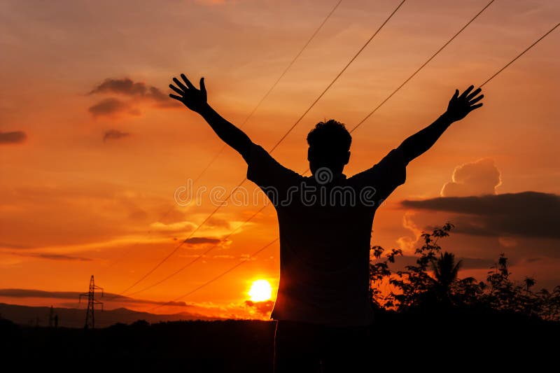 Silhouette of a Man with Hands Raised Stock Photo - Image of serenity ...