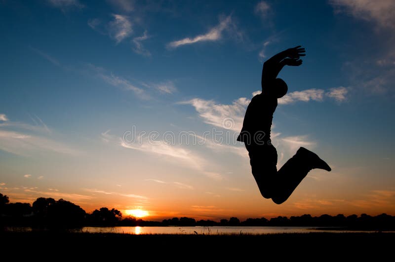 Silhouette of a Man Jumping in the Sunset Stock Photo - Image of young ...