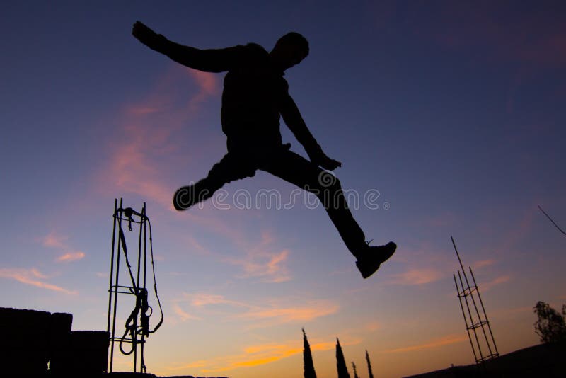 Silhouette of Man Jumping on Sunset Background Stock Photo - Image of ...