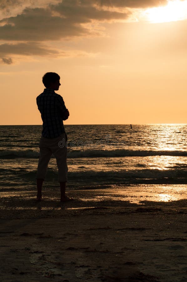 Silhouette Man Looking Out at Beach during Sunset Stock Photo - Image ...