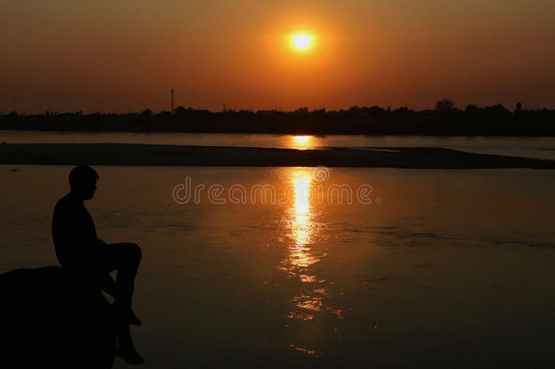Silhouette of a Man Looking at Sunset Stock Image - Image of darkness ...