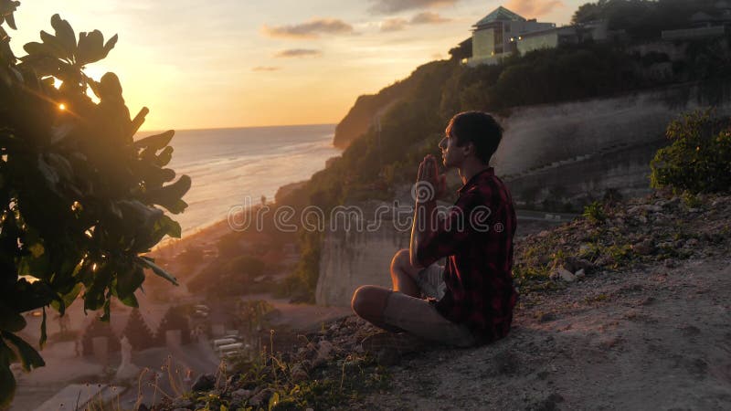 Silhouette of a Man Praying at Sunset Concept of Religion. Silhouette ...
