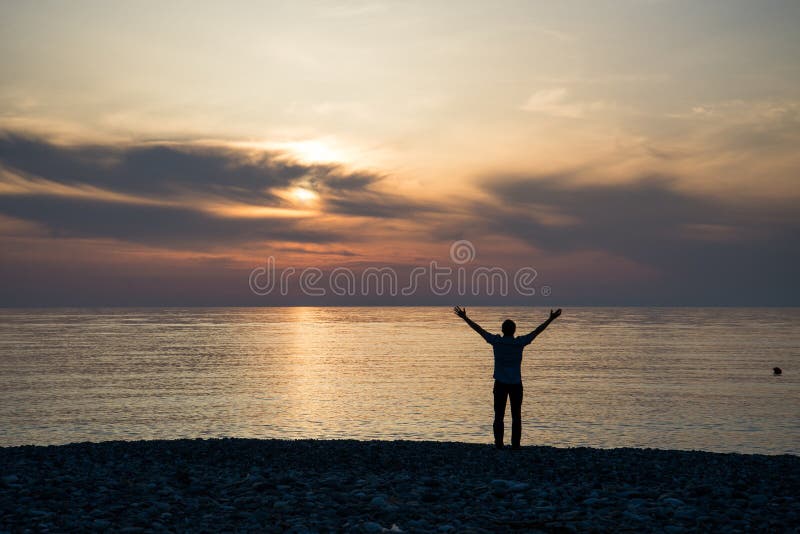 Silhouette of Man Raising His Hands or Open Arms when Sun Rising Up ...