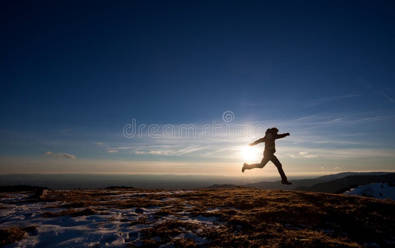Silhouette of Man Running in Sunset Sky Stock Image - Image of cliff ...