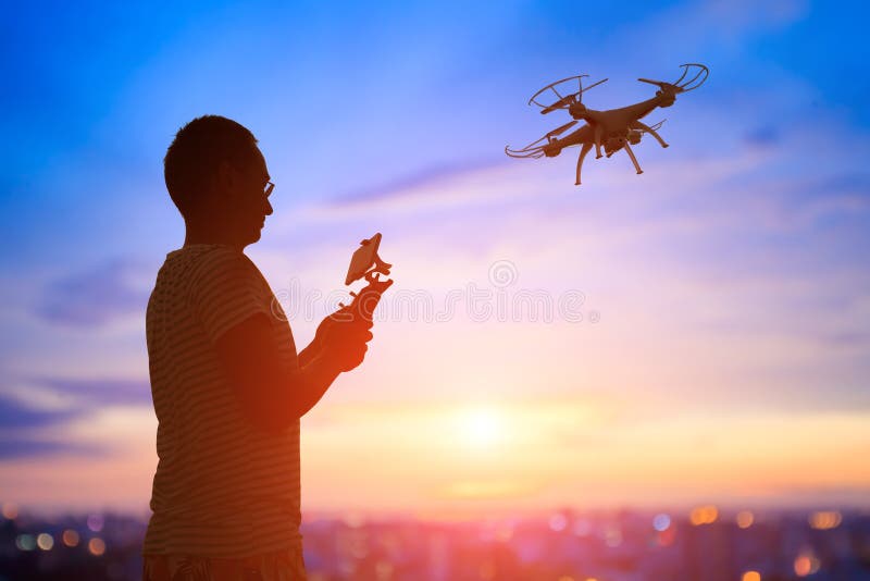 Silhouette of Man Take Drone Stock Image - Image of helicopter, people ...