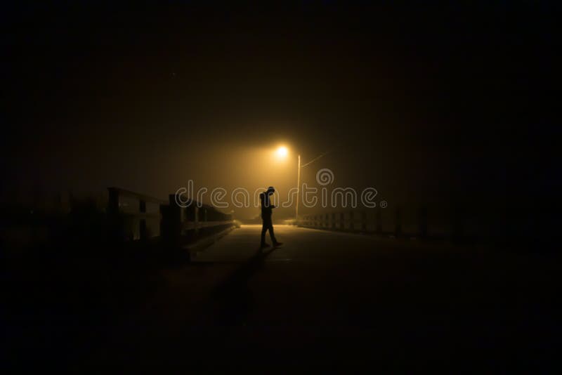 Silhouette of a Man Under a Street Light Stock Photo - Image of couple ...
