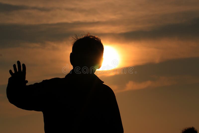 Silhouette of Man Waving at Sunset Stock Image - Image of male, dusk ...