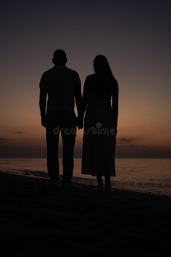 Silhouette of a Man and a Woman at Dawn Stock Photo - Image of girl ...