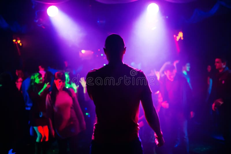 Silhouette of the MC with a Microphone on Stage of Nightclub Stock ...