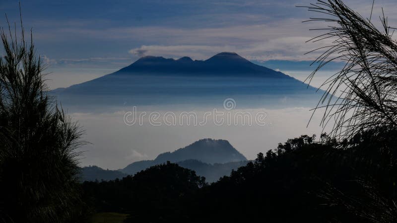 Silhouette of Mount Arjuno and Welirang with Their Peaks Covered in ...