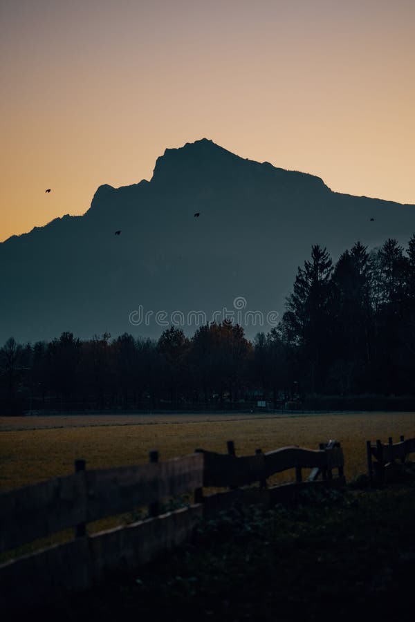 Silhouette of a Mountain Peak Against Sunset, Vertical Shot Stock Photo ...