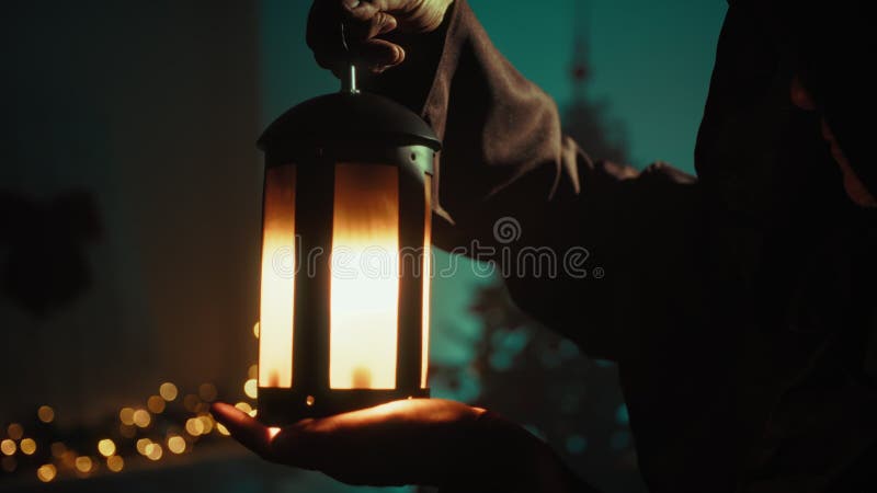 Silhouette of a Mysterious Monk with Torch in Front of Christmas Tree ...