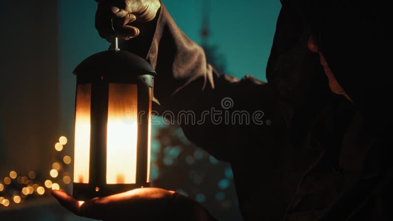 Silhouette of a Mysterious Monk with Torch in Front of Christmas Tree ...