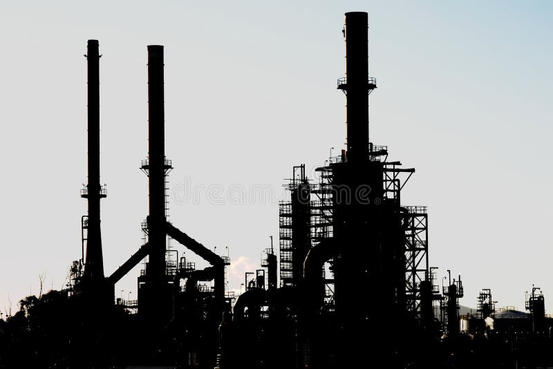 Silhouette of an Oil Refinery with Chimneys Stock Image - Image of ...