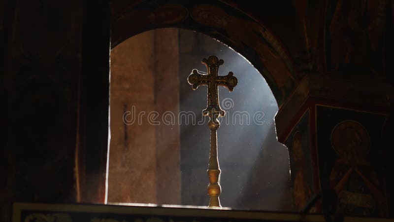 Silhouette of an Orthodox Cross in a Ray of Sunlight from a Small ...