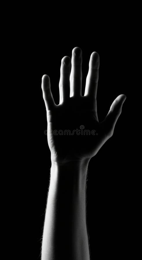 Silhouette of Outstretched Hand Against Black Background with Dramatic ...