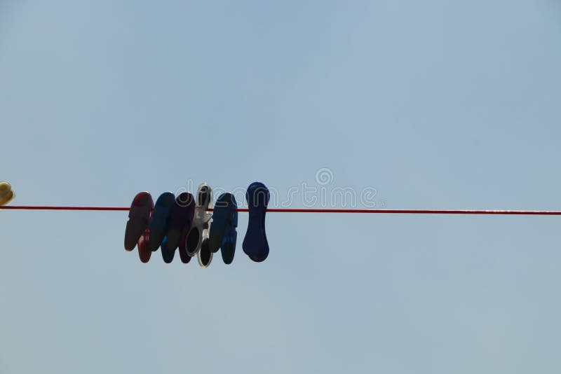Silhouette of Pegs Hanging from a Washing Line at Dusk Stock Photo ...