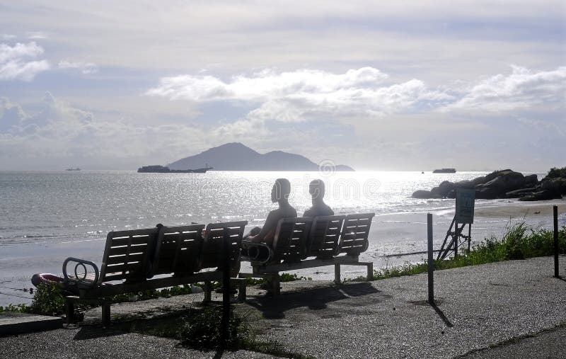 Silhouette People, Bench, Beach, Ocean, Mountains and Clouds Stock ...