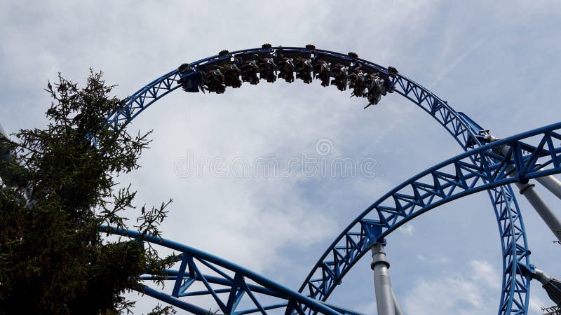 Silhouette of People Having Fun on the "Blue Fire" Looping ...