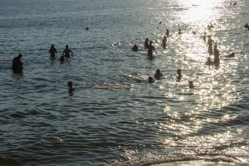 Silhouette of People Inside the Sea Editorial Photo - Image of sunset ...