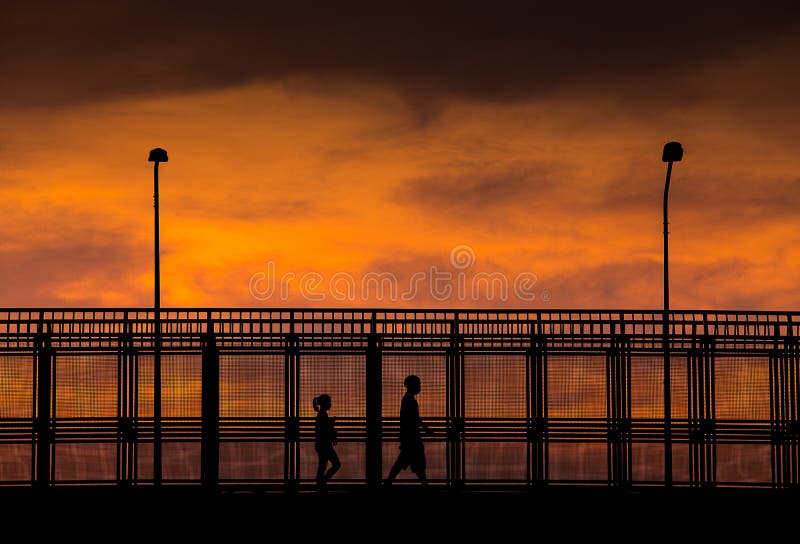 Silhouette of People Walking on Overpass Stock Image - Image of road ...