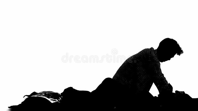 Silhouette of a Person in a Dynamic Pose Against a White Background ...