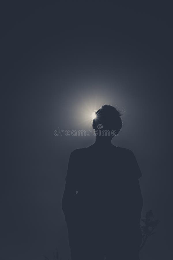 Silhouette of a Person with Sun Behind Causing Sun Eclipse Effect Stock ...
