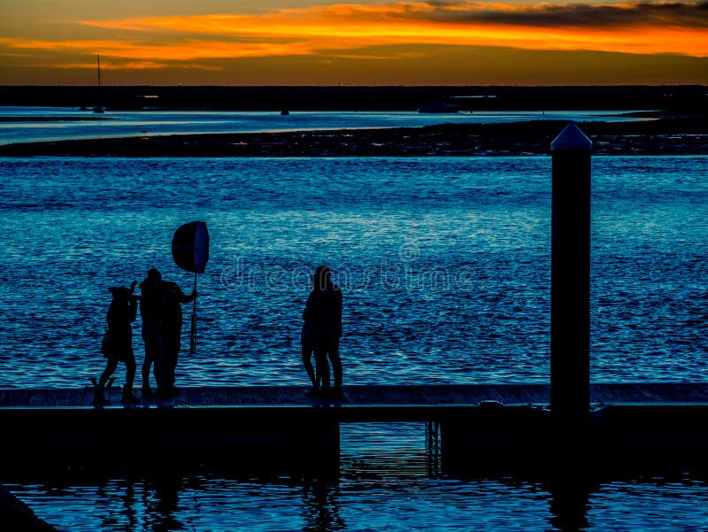Silhouette of a Photo Shoot Session at Sunset Stock Image - Image of ...