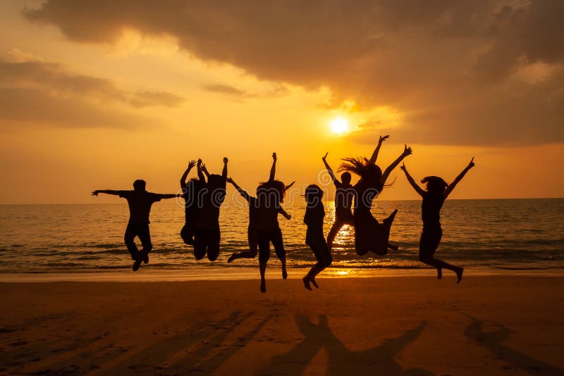 Silhouette Photo of the Team Celebration on the Beach at Sunset Stock ...