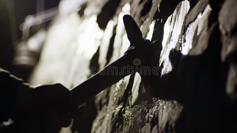 Silhouette of Pickaxe Striking Rock Wall Stock Footage - Video of rock ...