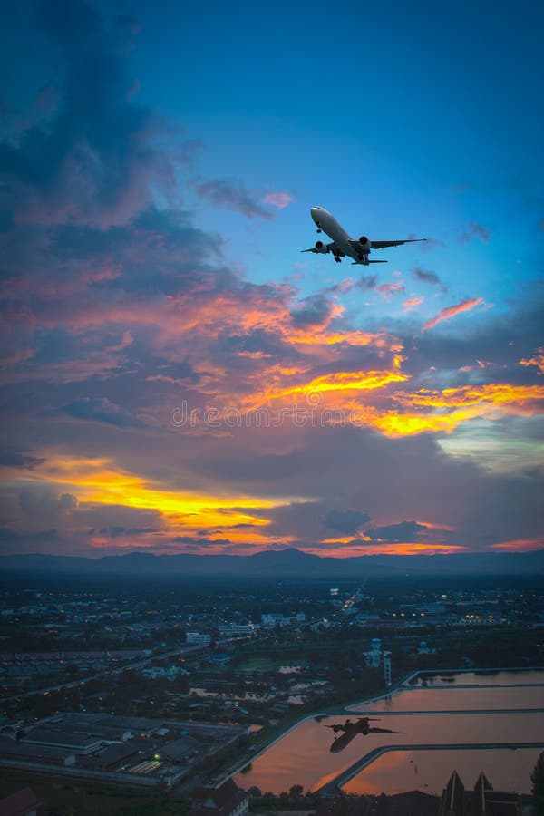 Silhouette of Plane Fly Over Sky and City Stock Image - Image of ...