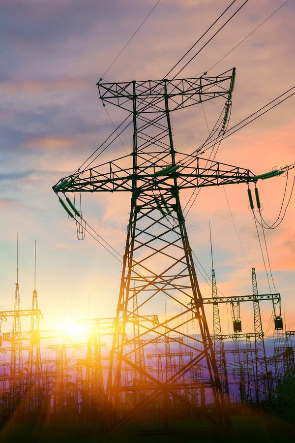 Silhouette of Power Lines in the Factory and Sunset Background Stock ...