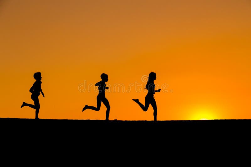 Silhouette of Running Kids Against Sunset Stock Image - Image of ...